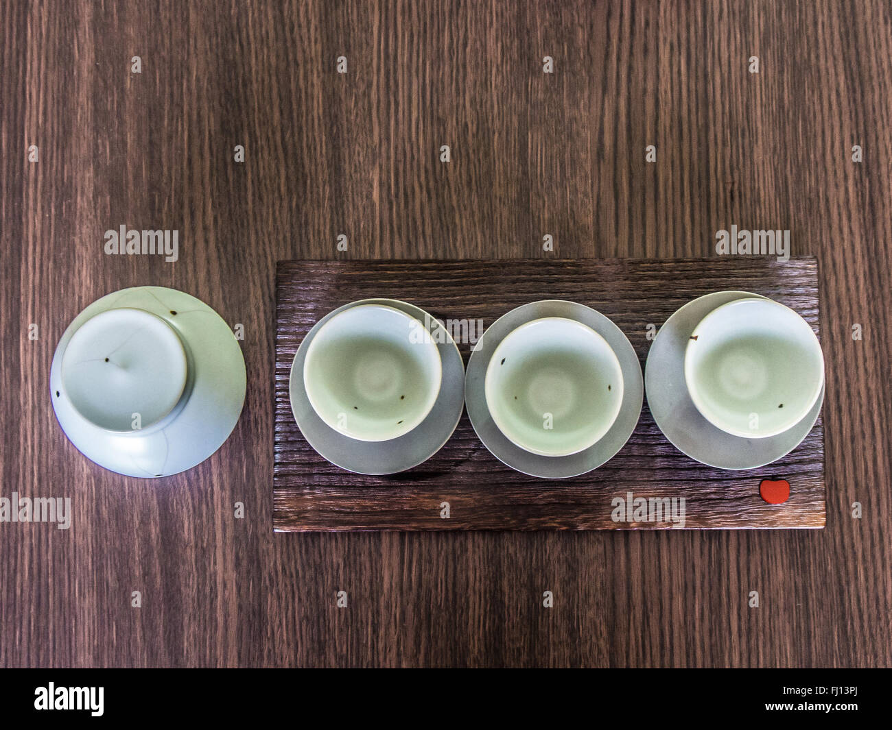 Tea cups and tea leaf container Stock Photo - Alamy
