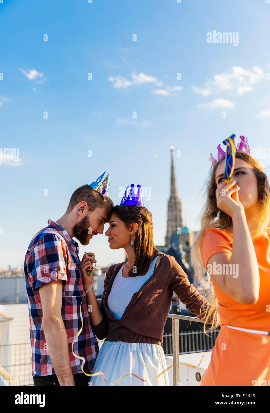 Austria, Vienna, Young people having a party on rooftop terrace Stock ...