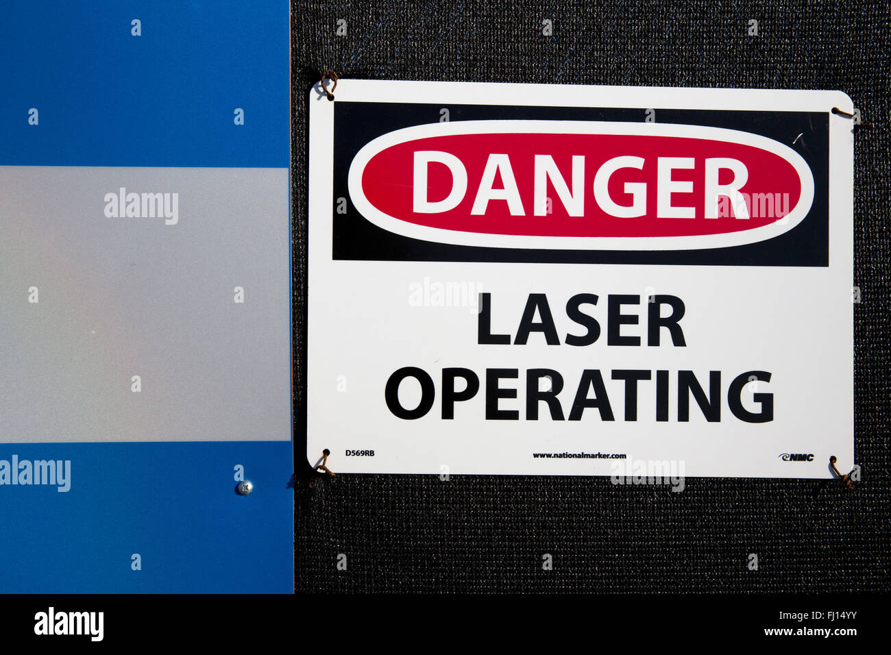 industrial laser warning sign Stock Photo - Alamy