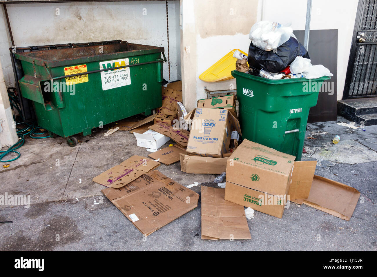 Bin in alley hi-res stock photography and images - Alamy