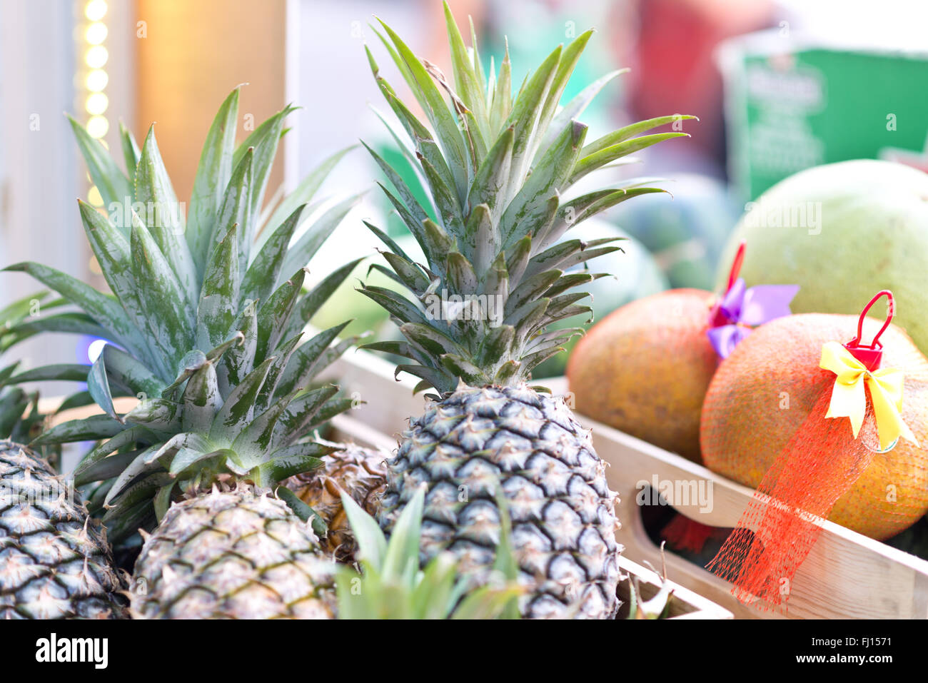 ripe big pineapples in a wooden box Stock Photo - Alamy