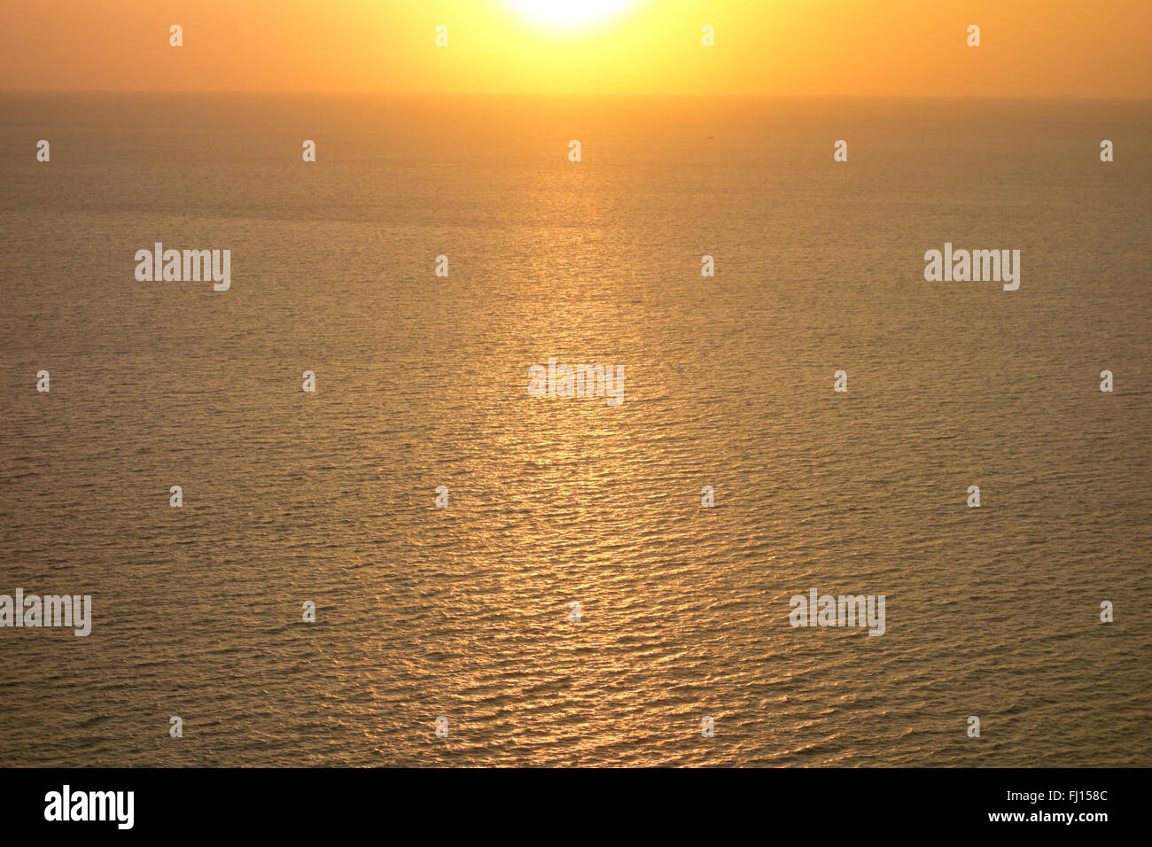 golden sunset over ocean Stock Photo - Alamy