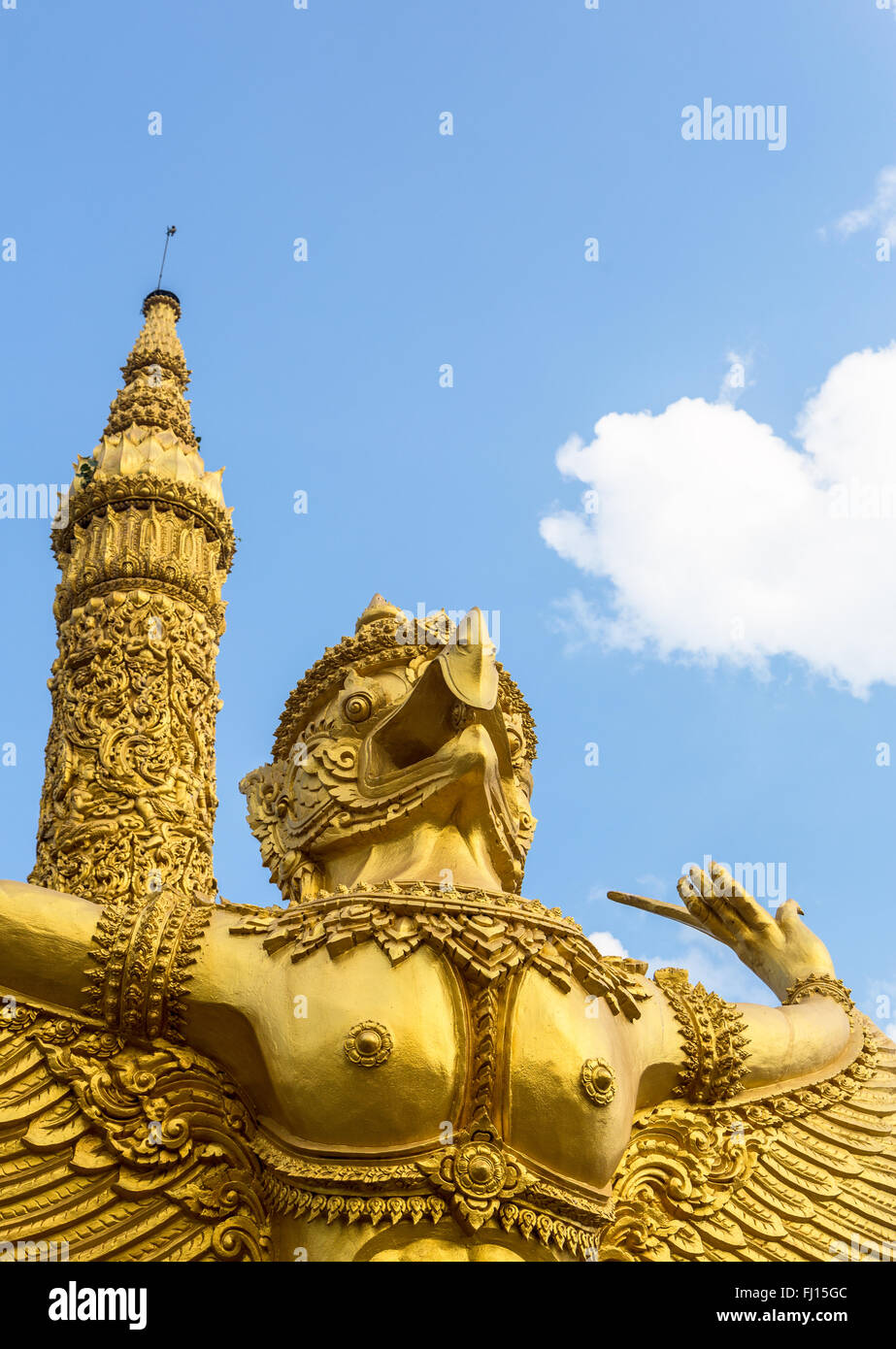 A statue of a golden Garuda, a bird like creature common in both ...