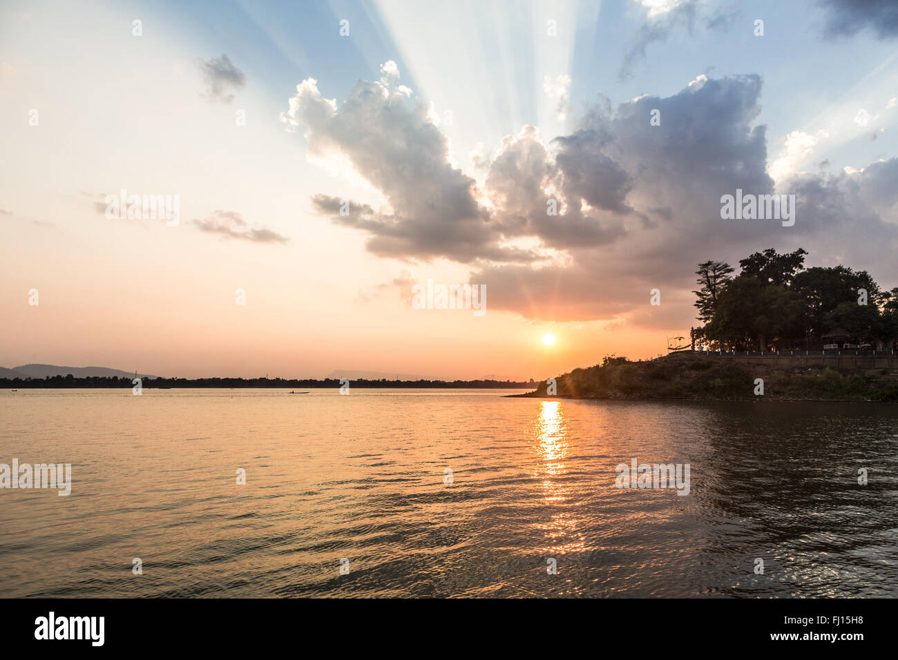 Stunning sunset over the Mekong river in Pakse in Champasak province in ...