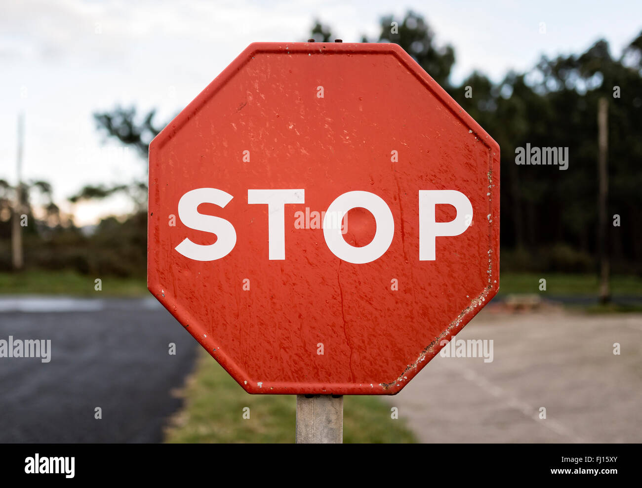 Spain, wet stop sign Stock Photo - Alamy