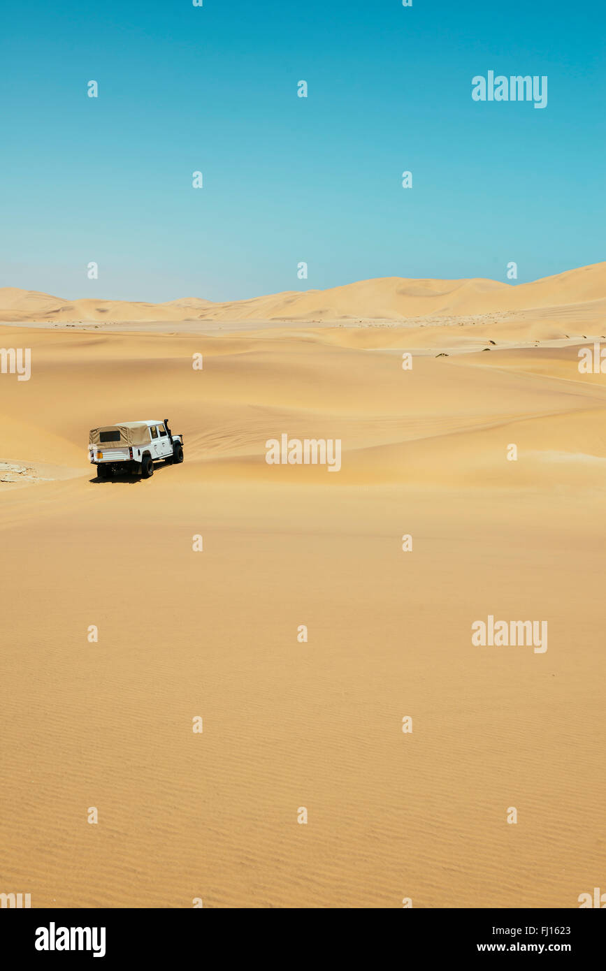 Namibia, Namib desert, Swakopmund, 4x4 car driving among the dunes in ...