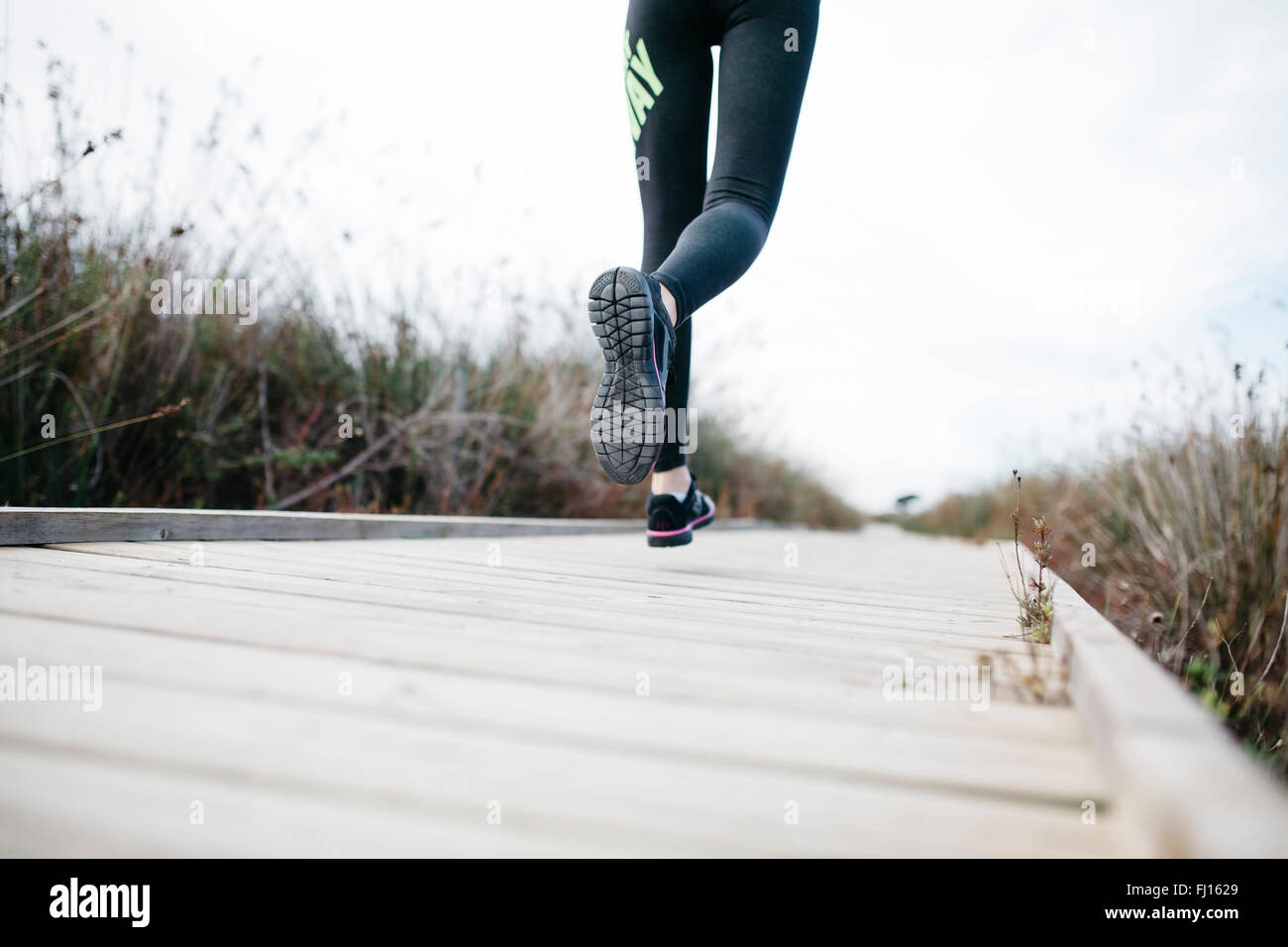 Spain, Tarragona, Woman running on a catwalk Stock Photo - Alamy