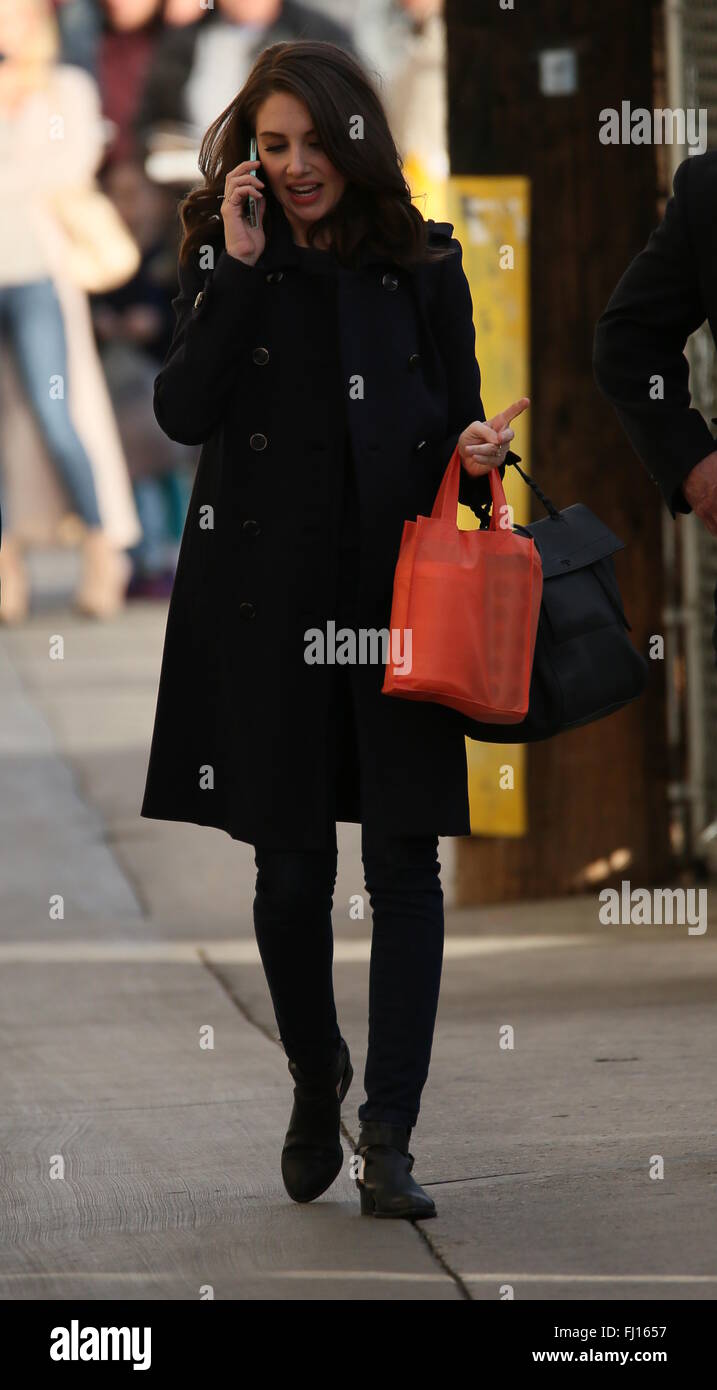 Alison Brie talks on her cell phone as she arrives at the ABC studios ...