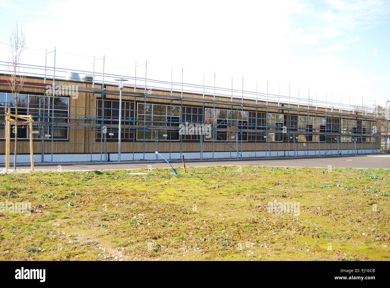 Facade of school under construction Stock Photo - Alamy