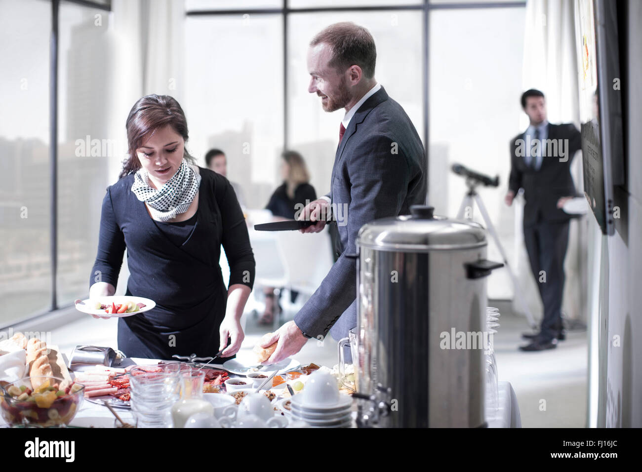 Business people having buffet breakfast at hotel Stock Photo - Alamy