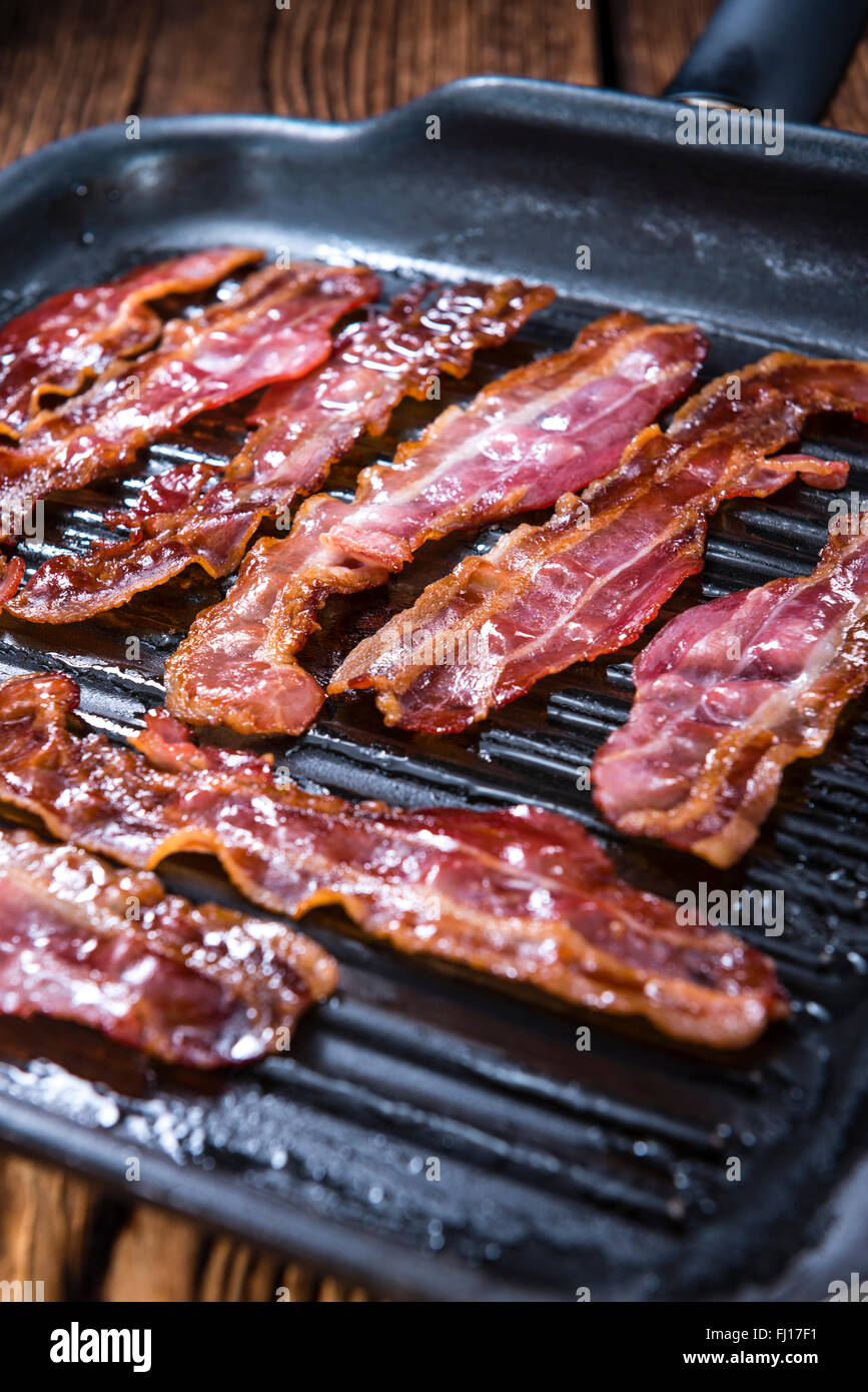Portion of fried Bacon in a pan (close-up shot Stock Photo - Alamy