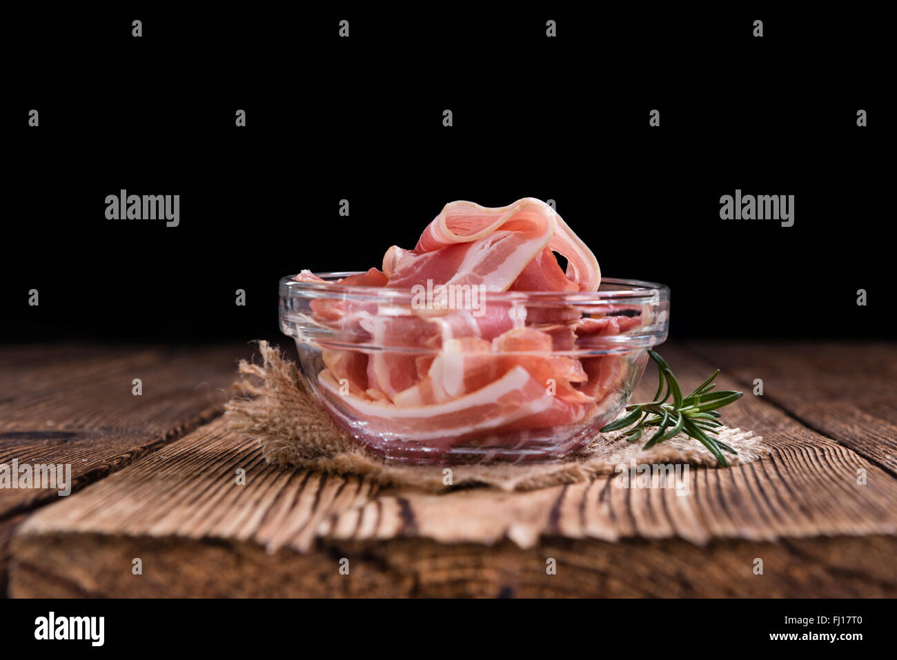 Bacon (raw) as detailed close-up shot on an old wooden table Stock ...