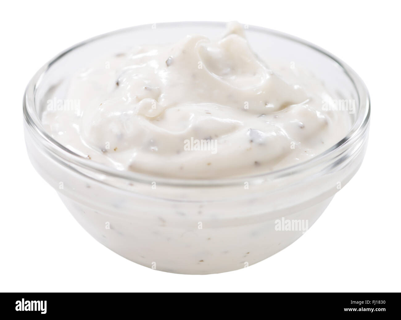 Sour Cream with fresh herbs (close-up shot) isolated on white ...