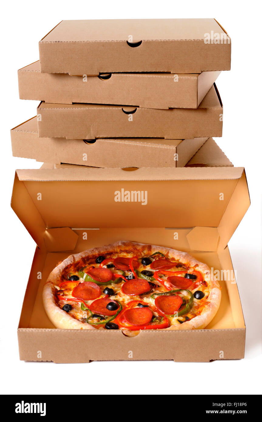 Freshly baked Italian pepperoni Pizza with a stack of delivery boxes ...