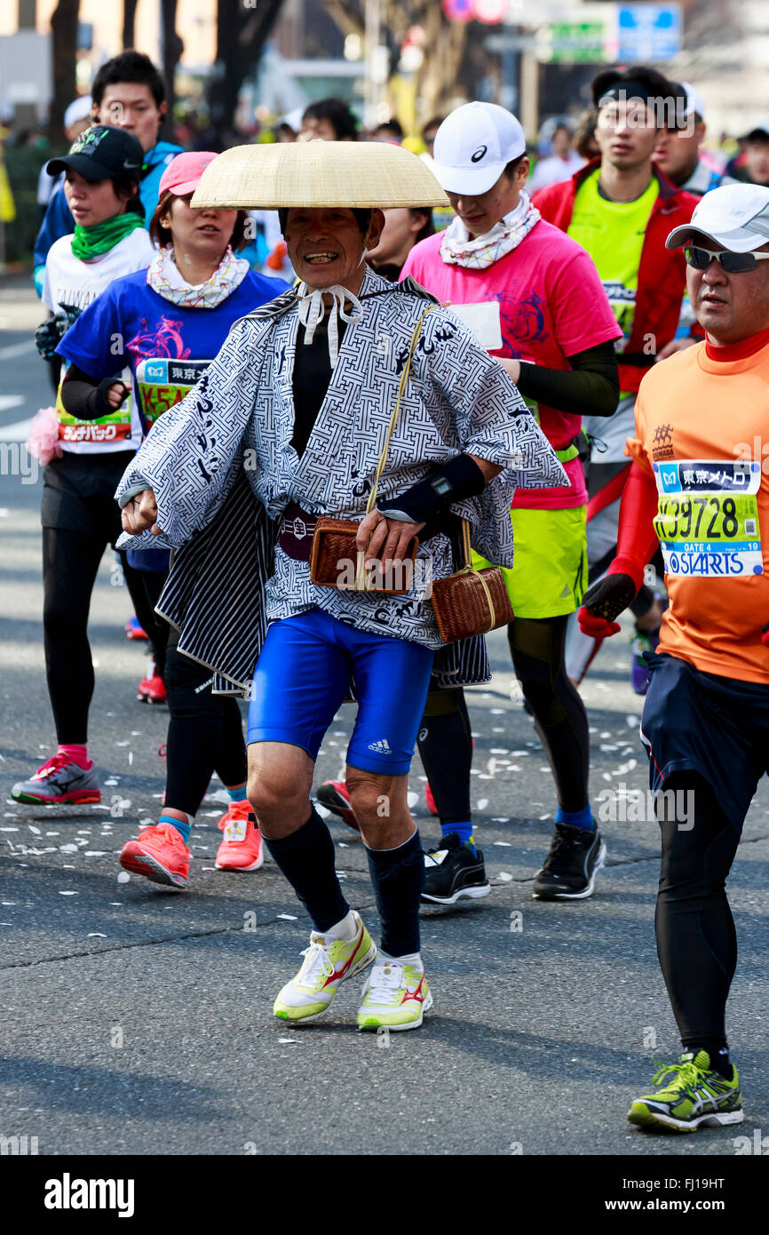 A costumed runner takes part in the Tokyo Marathon on February 28, 2016 ...
