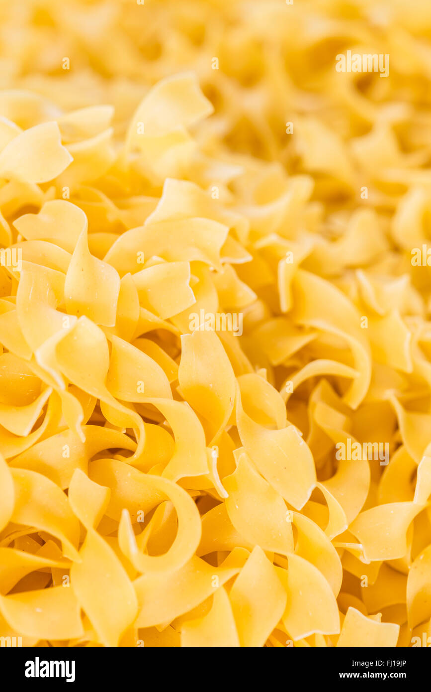 Portion of raw Tagliatelle (detailed close-up shot) for use as ...
