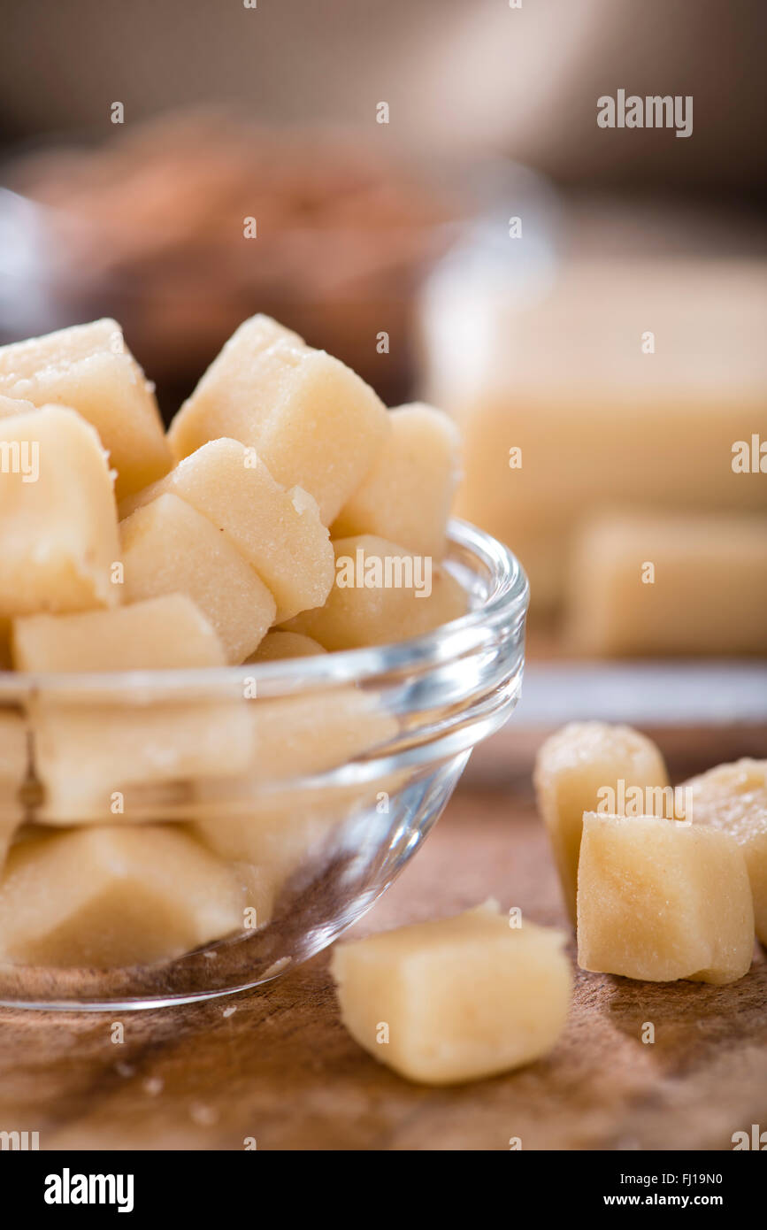 Raw Marzipan (close-up shot) with almonds on wooden background Stock ...
