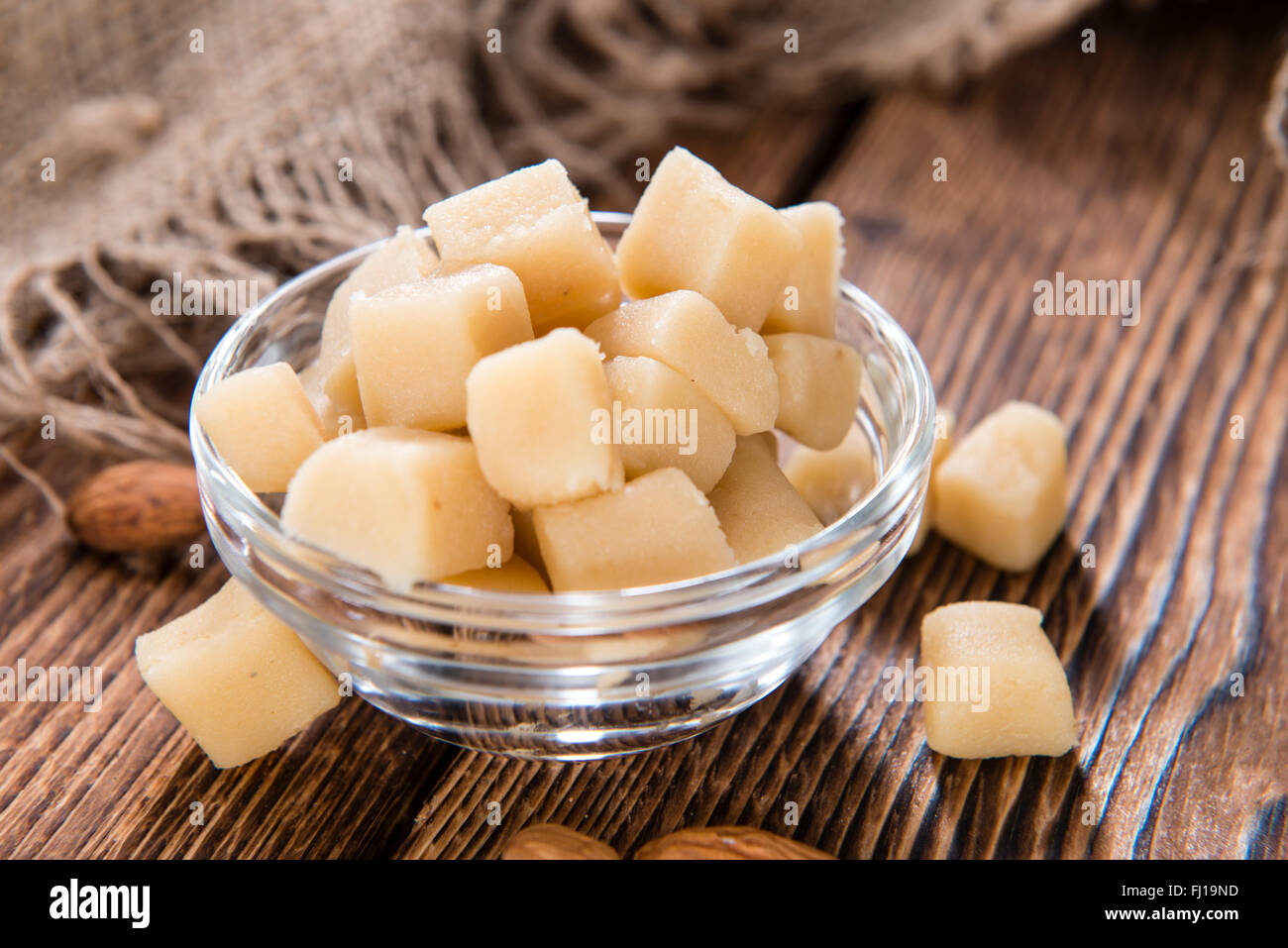 Portion of Marzipan (close-up shot) on wooden background Stock Photo ...