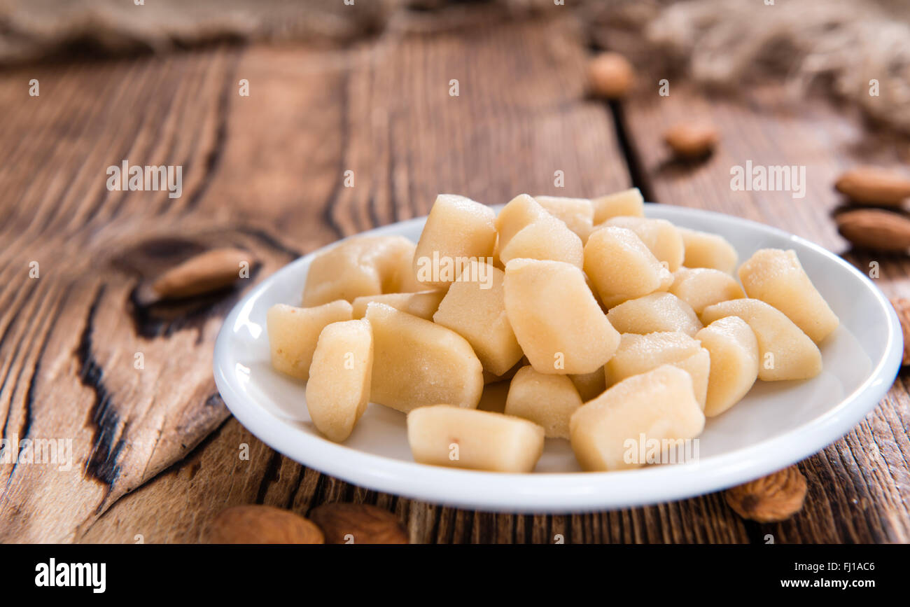 Raw Marzipan (close-up shot) on vintage wooden background Stock Photo ...
