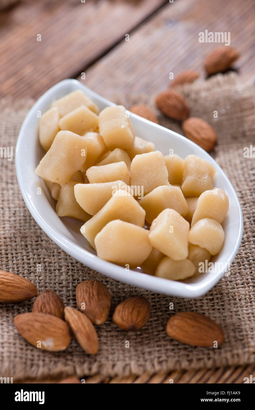 Marzipan with Almonds (close-up shot) on vintage wooden background ...