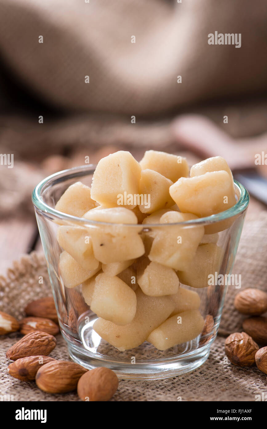 Portion of Marzipan (close-up shot) on wooden background Stock Photo ...