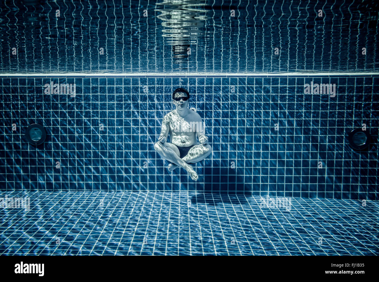 Boy sitting underwater hi-res stock photography and images - Alamy