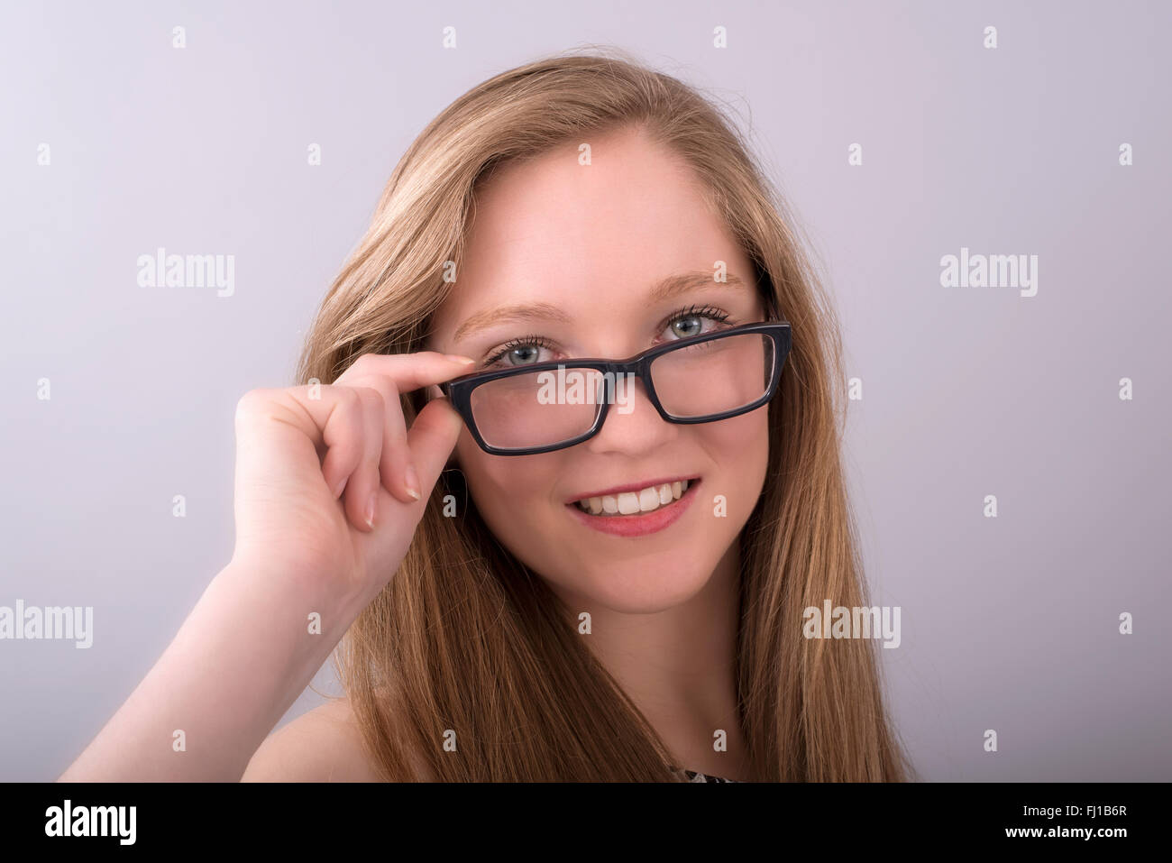 Attractive teenage girl wearing spectacles with a black frame Stock ...