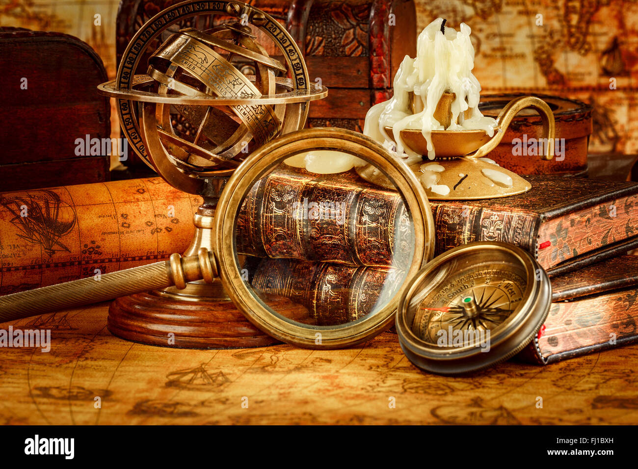 Vintage book, compass, telescope and a pocket watch lying on ancient ...