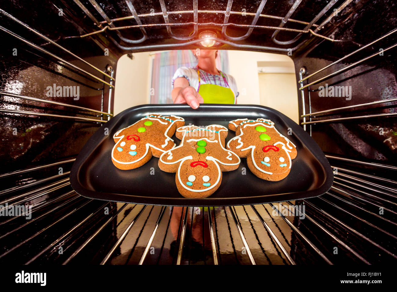 Baking Gingerbread man in the oven, view from the inside of the oven ...