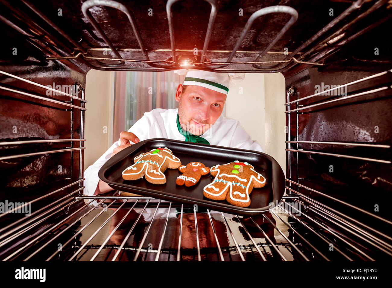 Baking Gingerbread man in the oven, view from the inside of the oven ...