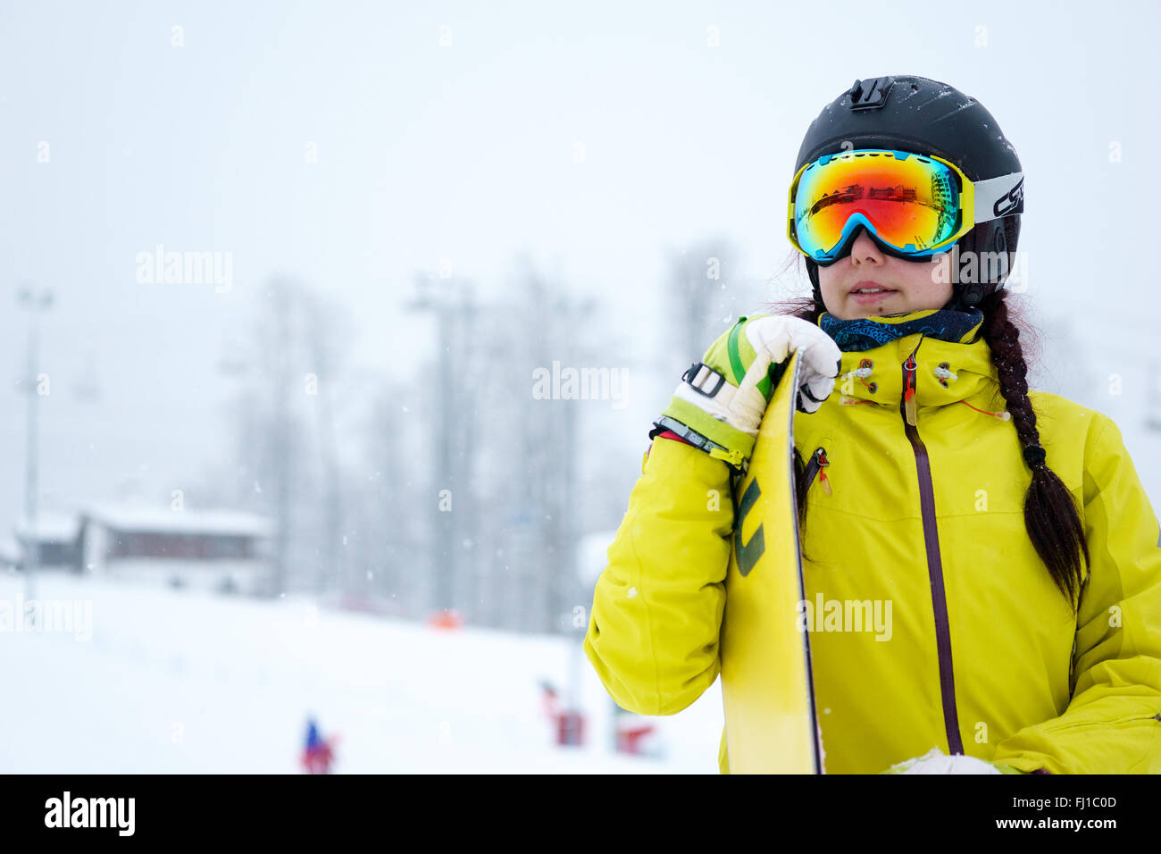 Young female snowboarder standing hi-res stock photography and images ...