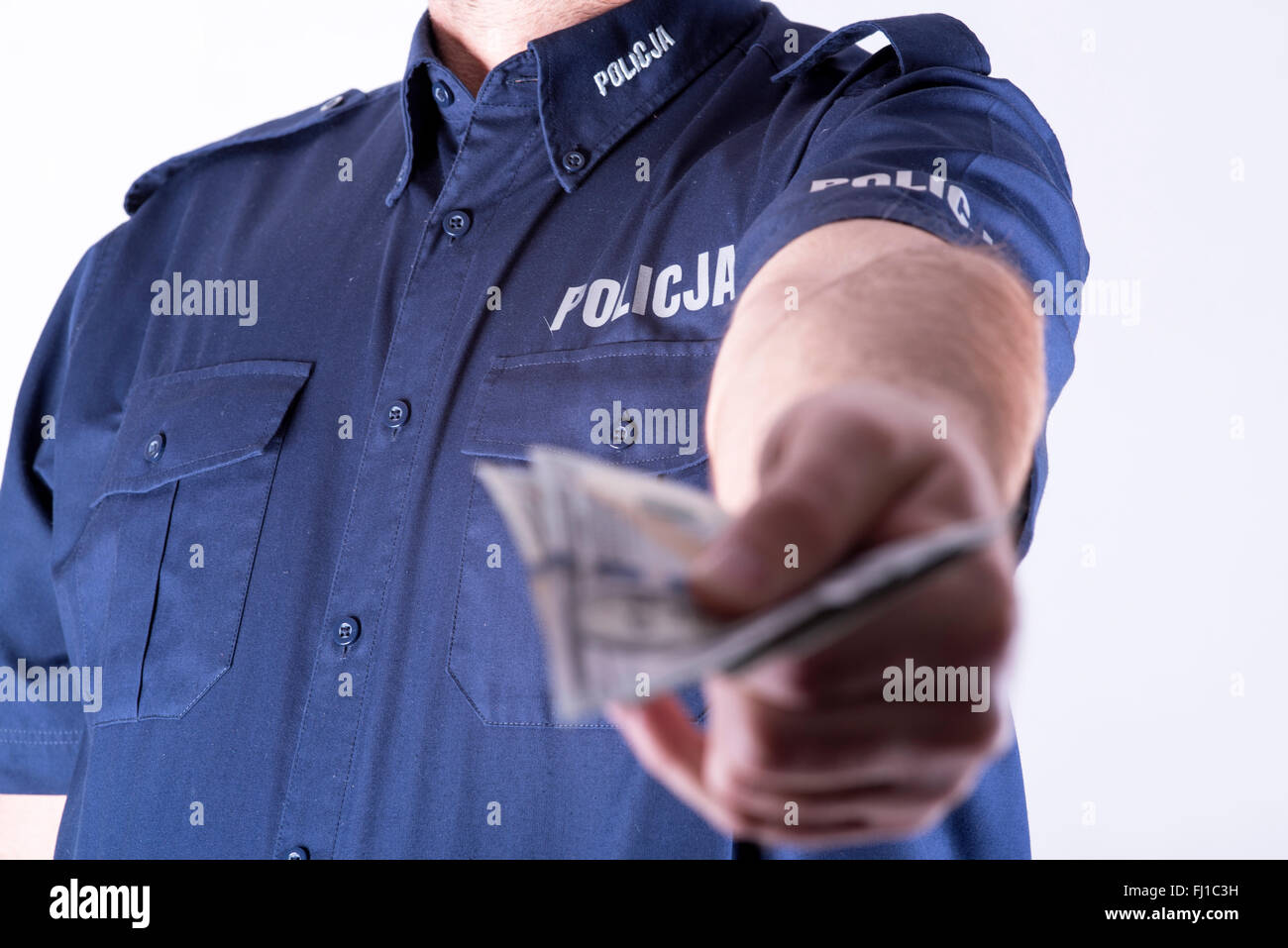 accepting bribes by corrupt Polish policeman Stock Photo - Alamy