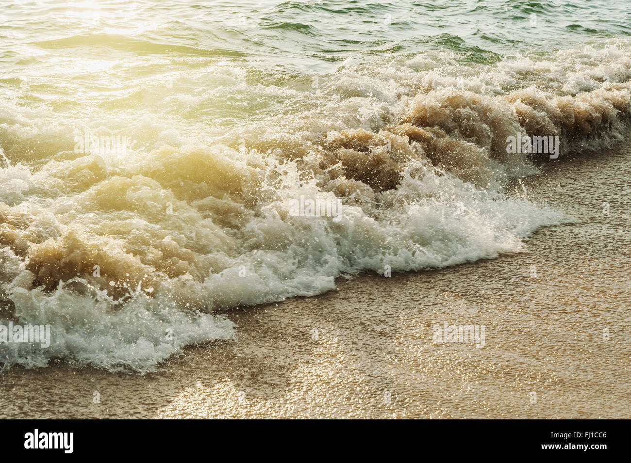 Texture of water with beach in evening over light Stock Photo - Alamy