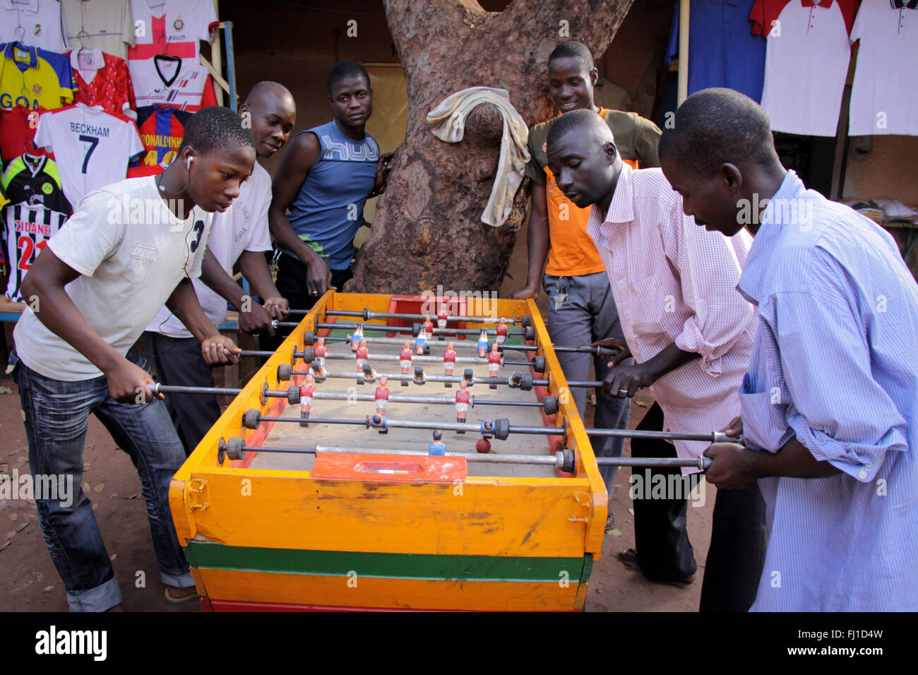 Group of young men playing Baby foot in the market in Bobo Dioulasso ...