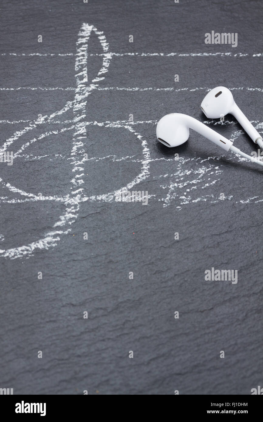 Music notes with headphones Stock Photo - Alamy