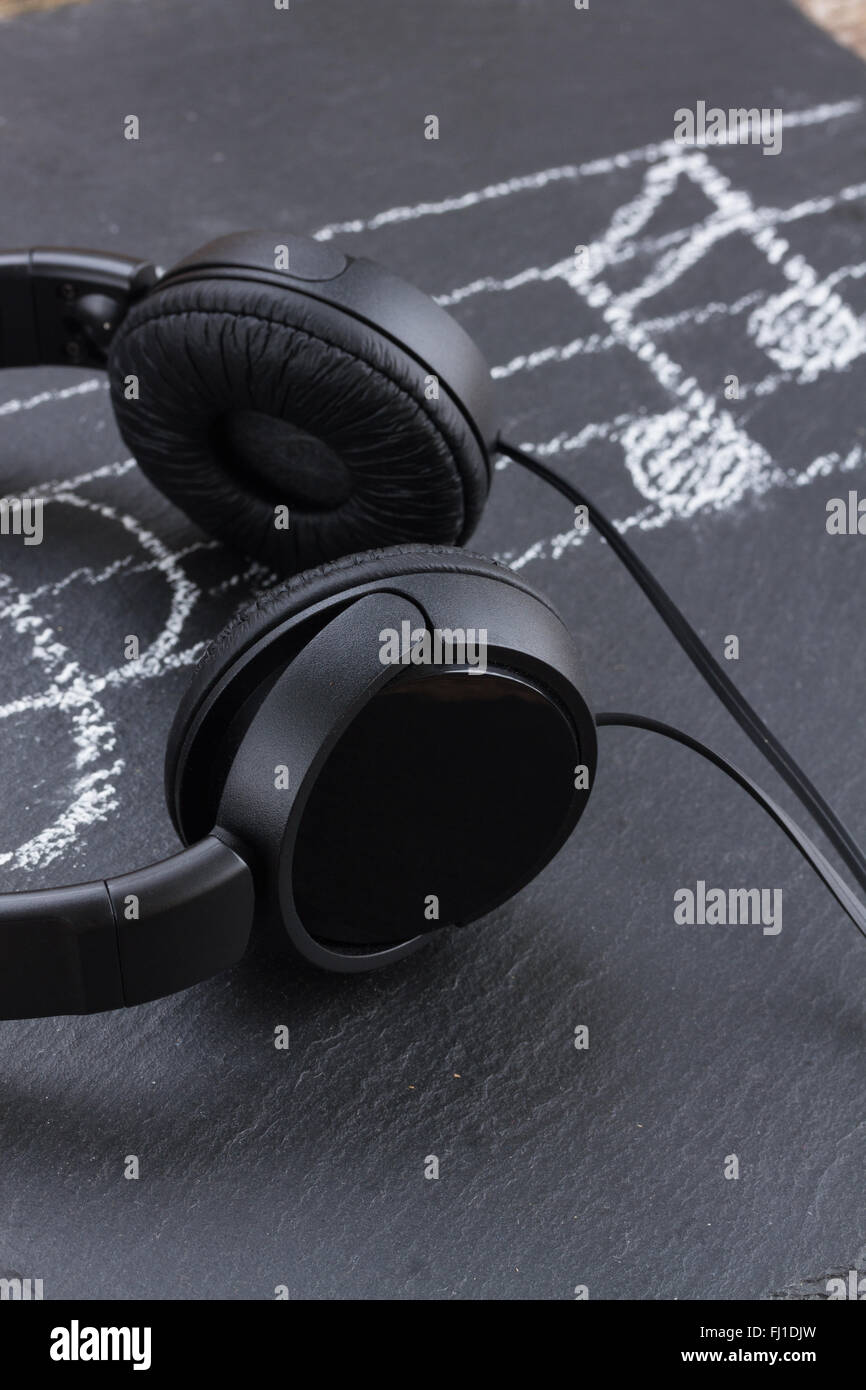 Music notes with headphones Stock Photo - Alamy