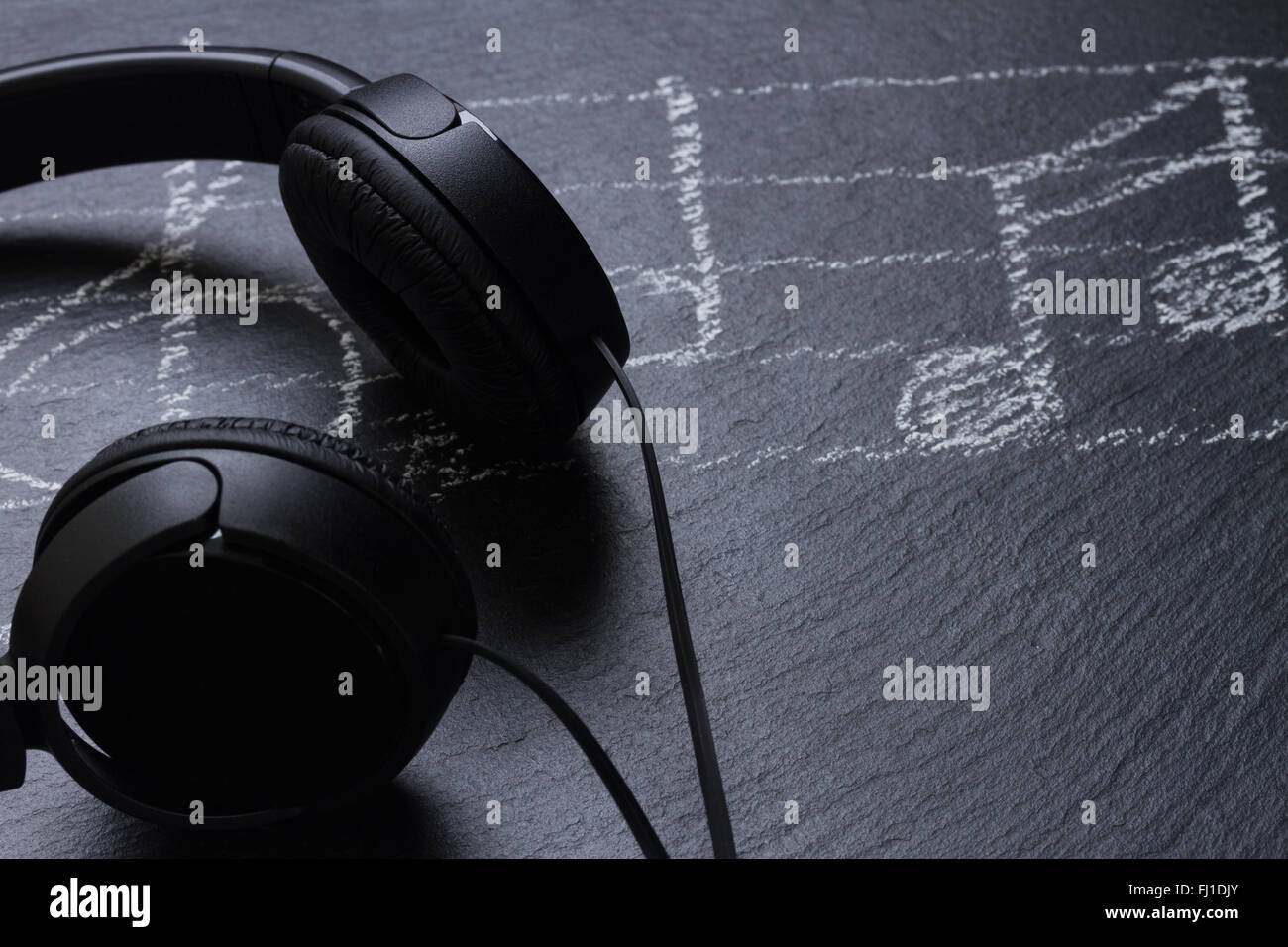Music notes with headphones Stock Photo - Alamy