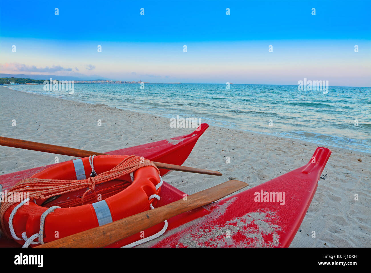 lifeguard boat at the beach at sunset Stock Photo - Alamy