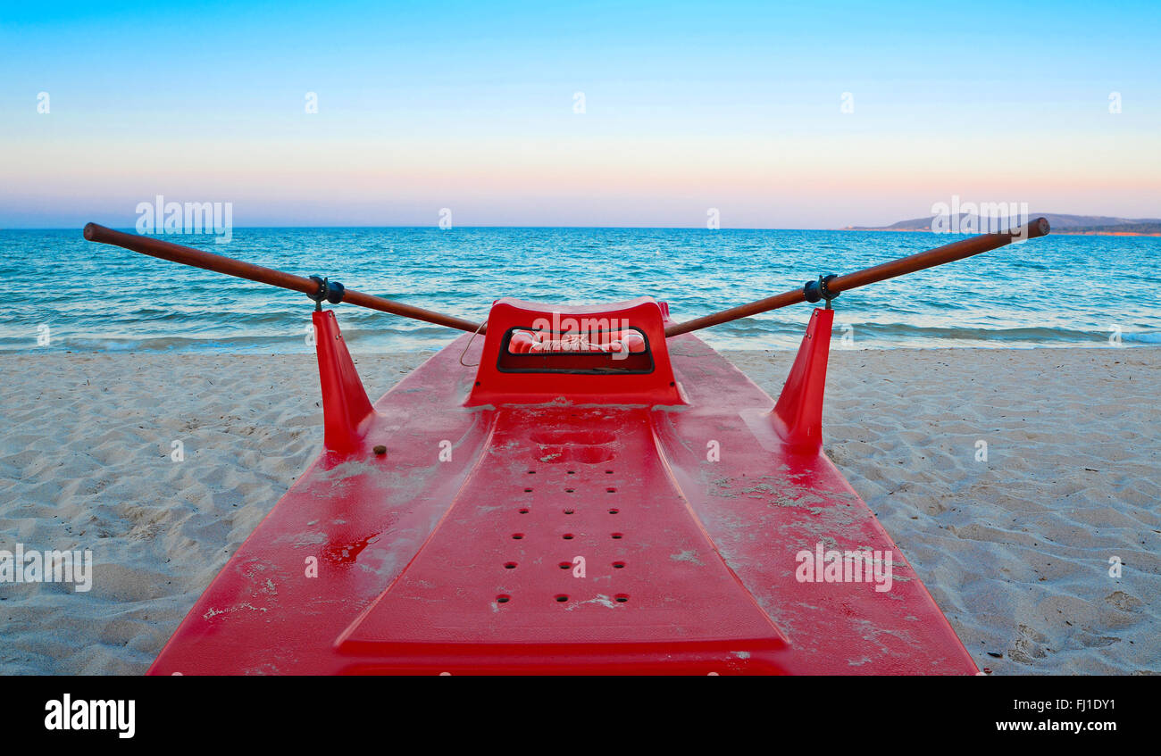 lifeguard boat at the beach at sunset Stock Photo - Alamy