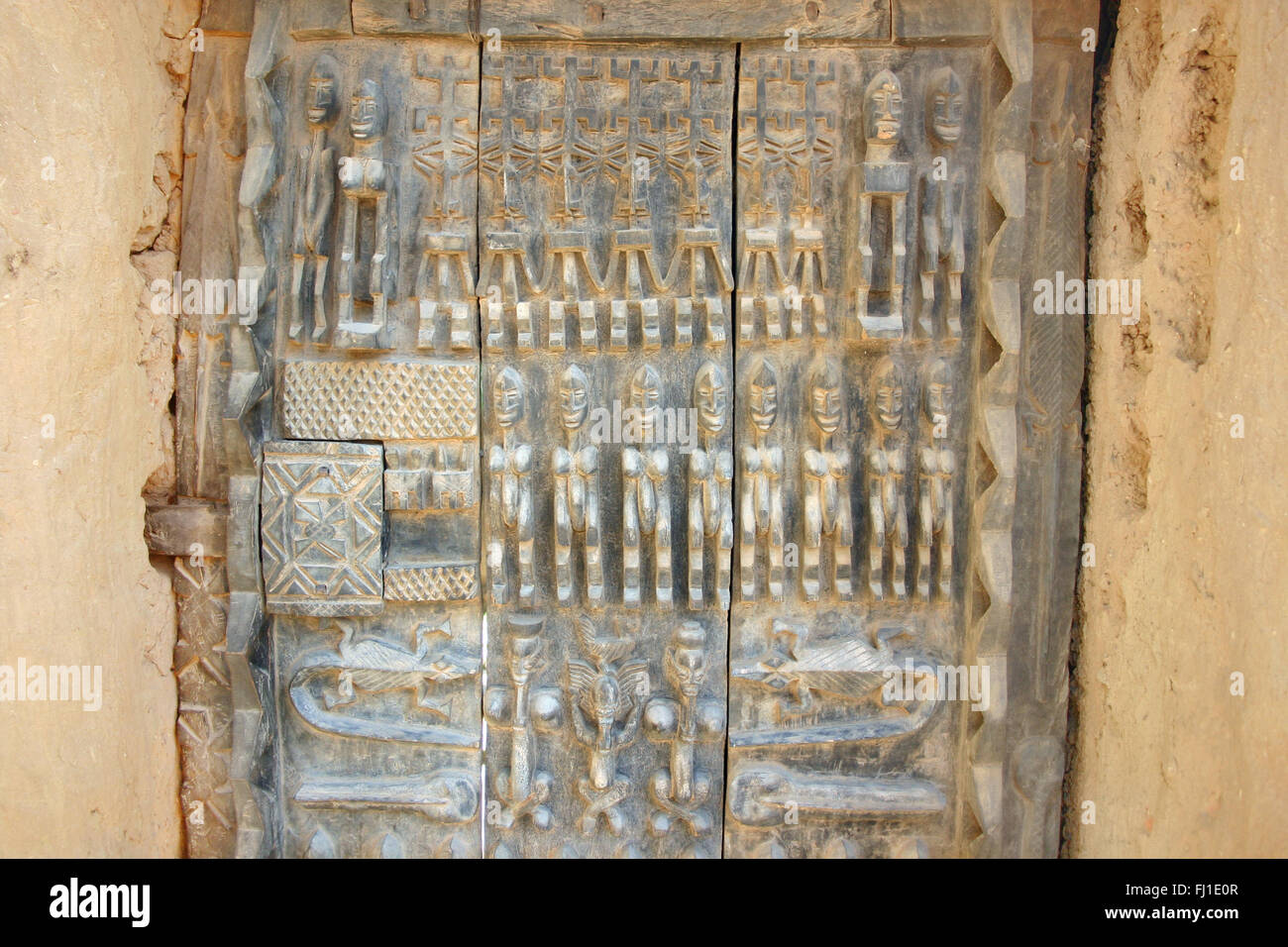 Typical carved wood granary door in Dogon village in Dogon country ...