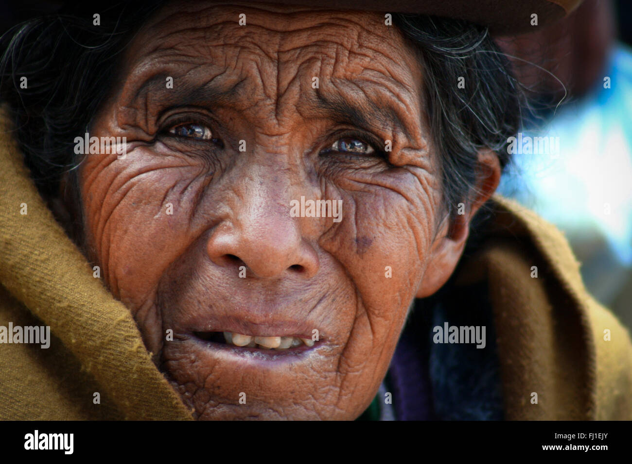 Portrait close up of lady woman from Bolivia with wrinkles and ...