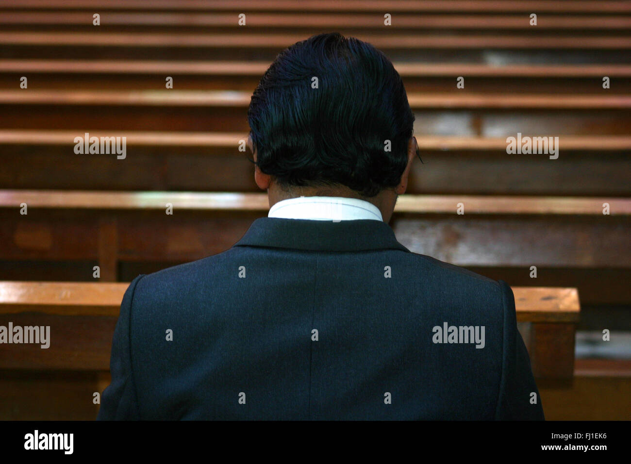 Mourning man praying in church in Potosi, Bolivia Stock Photo - Alamy