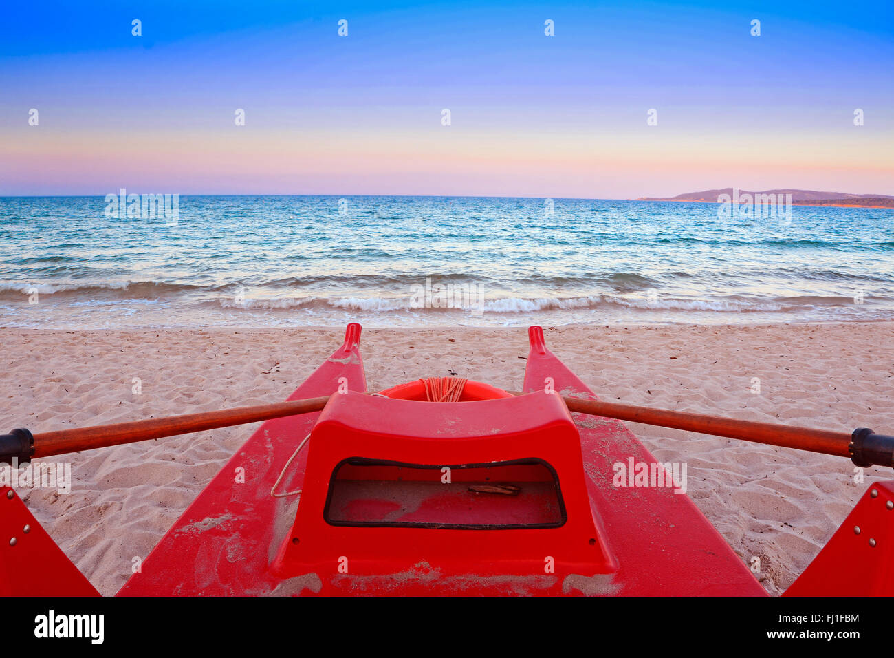 lifeguard boat at the beach at sunset Stock Photo - Alamy