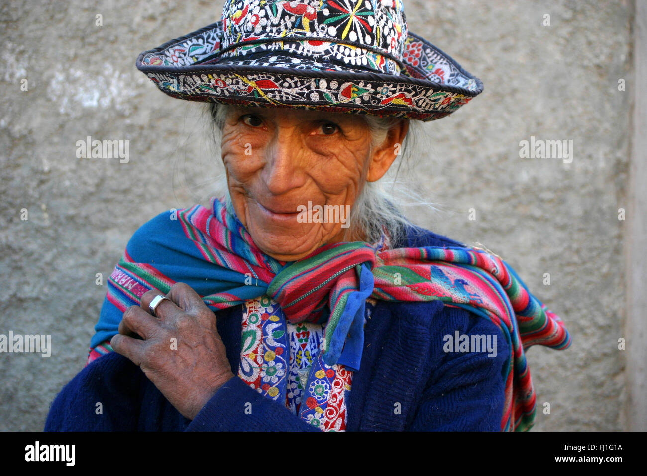 Portrait of Peruvian woman with traditional outfit and hat , Peru Stock ...