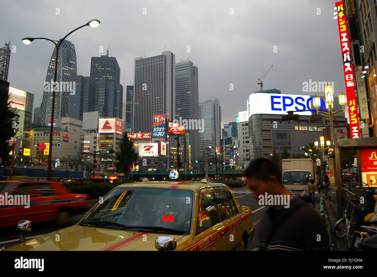 Japanese Yellow Taxi in Shinjuku Tokyo Japan at dusk with skyline by ...