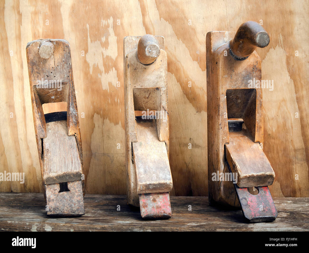 Old wood planers tools on wood background Stock Photo - Alamy