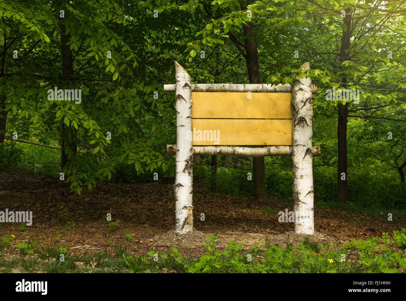 wooden sign board ready to put information in the woods Stock Photo - Alamy