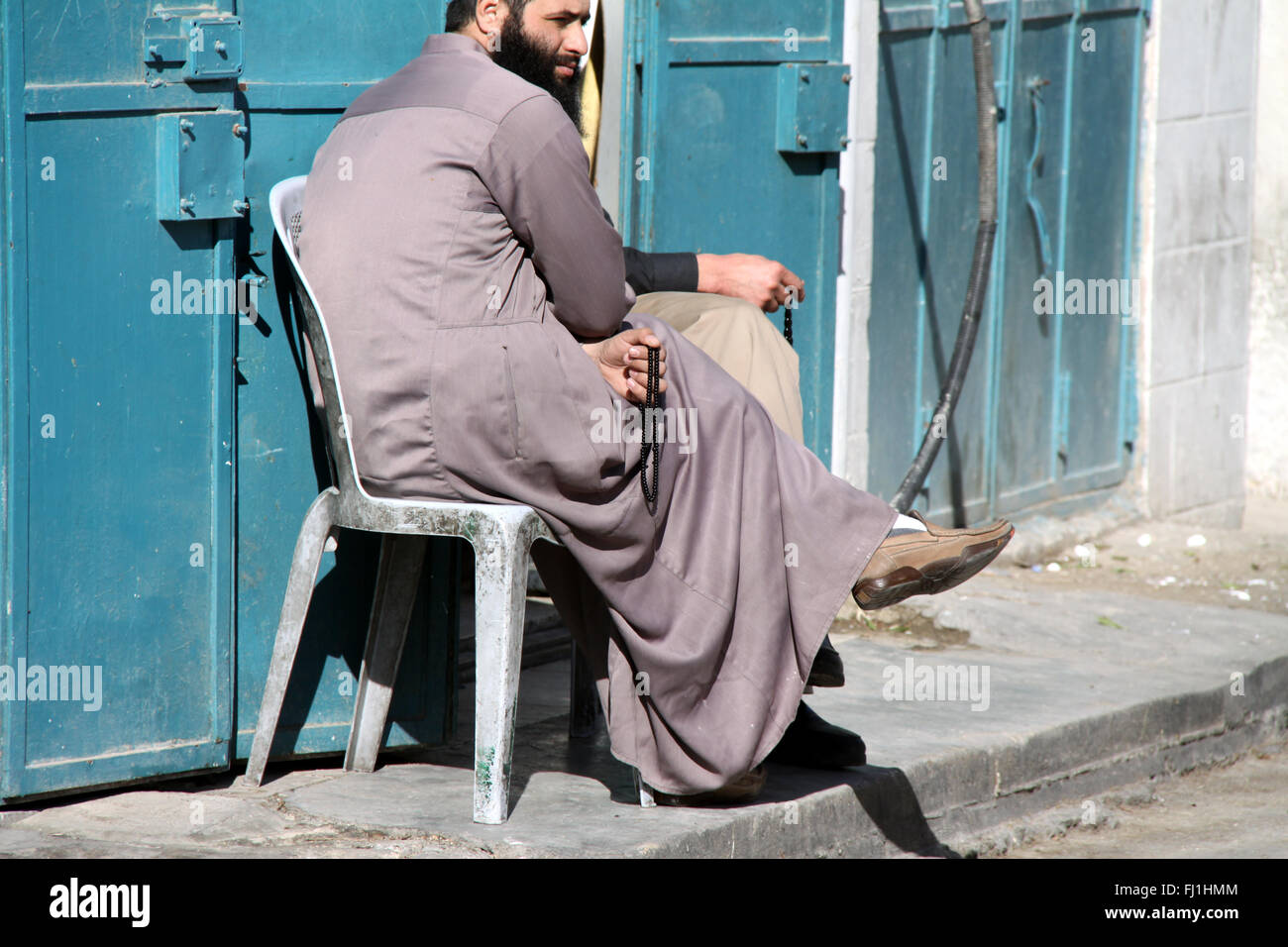 Muslim man praying in a street of Bethlehem, Palestine Stock Photo - Alamy