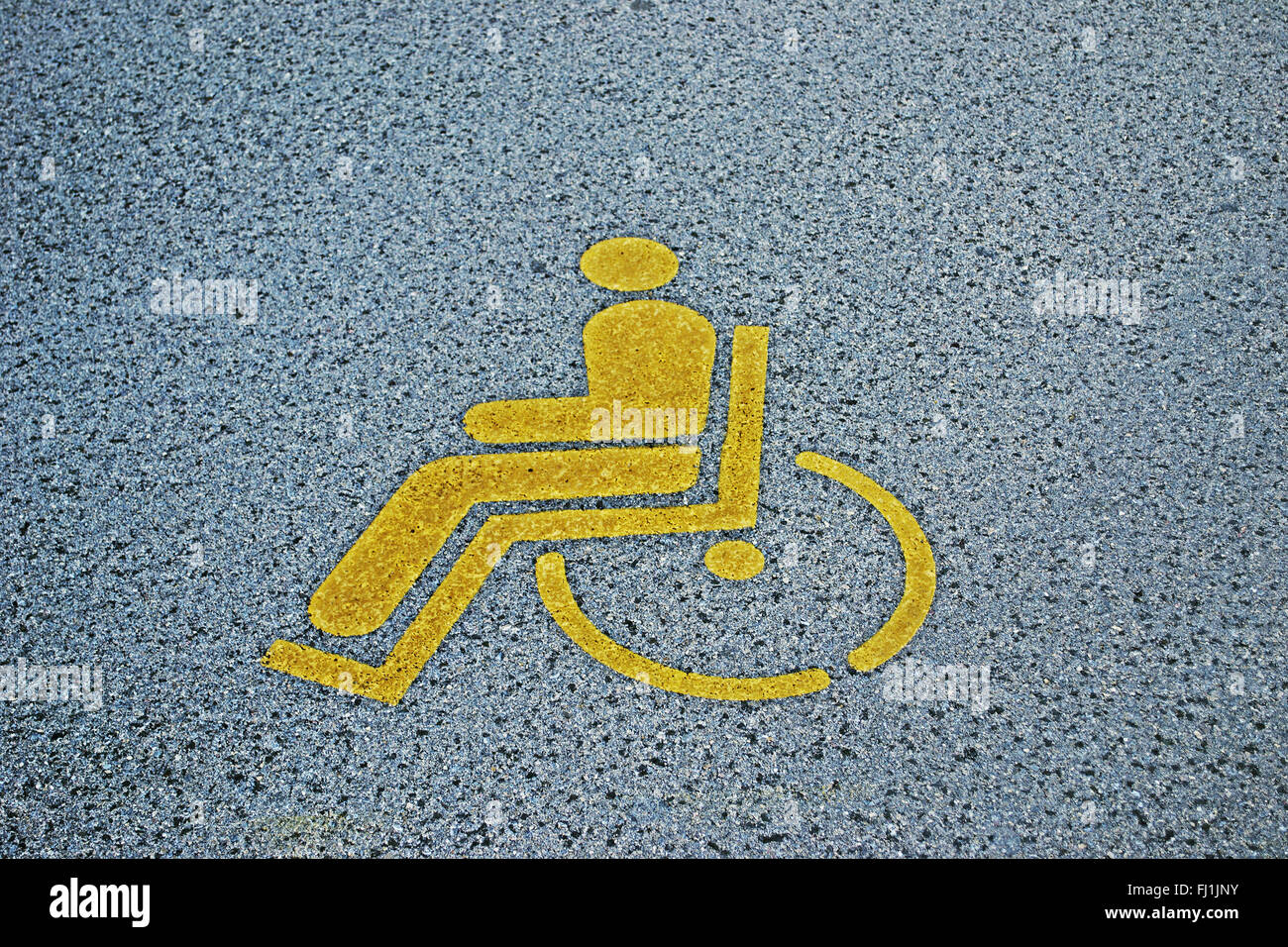 Yellow wheelchair sign on road hi-res stock photography and images - Alamy