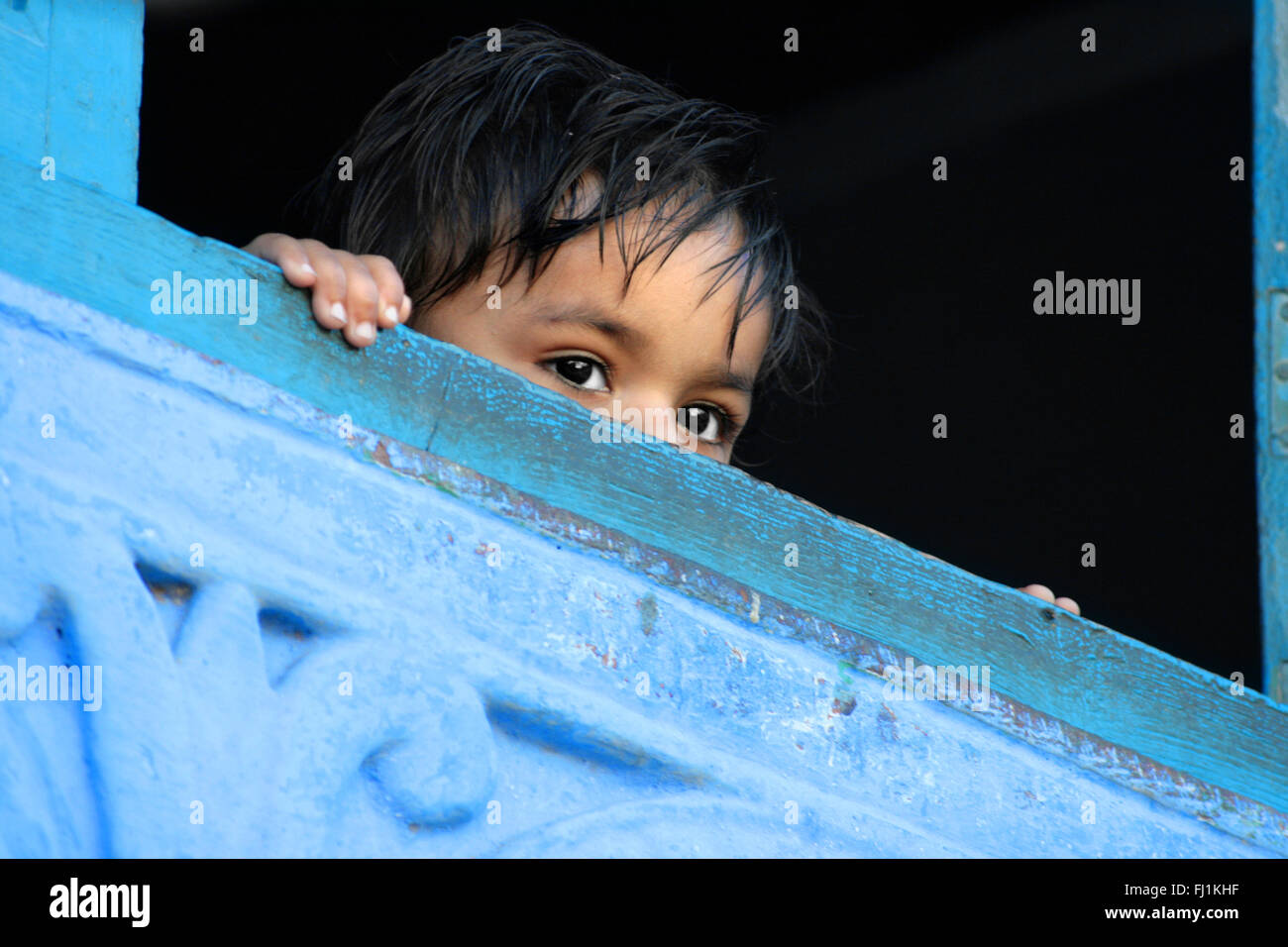 Child looking through a window in Jodhpur, India Stock Photo - Alamy